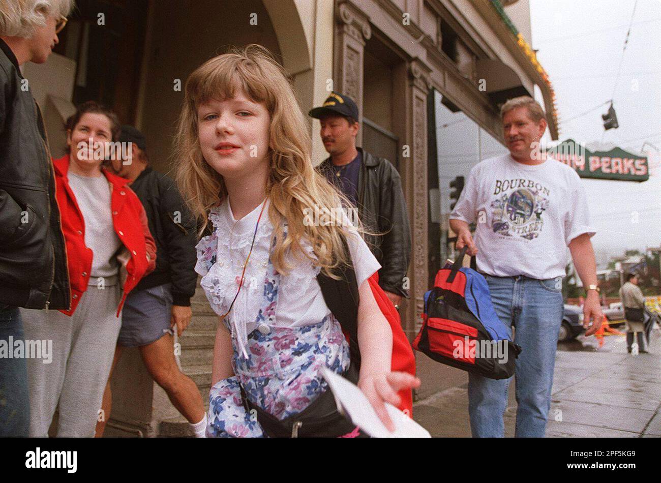 CASTRO 3/C/15APR96/SC/LS MEGAN ASSISTED WITH HER LUGGAGE BY DENNIS ...