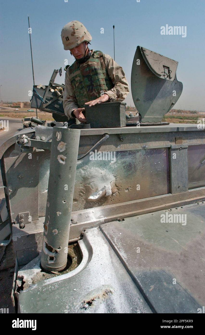 A soldier belonging to the 82nd airborne tries to remove the turret ...