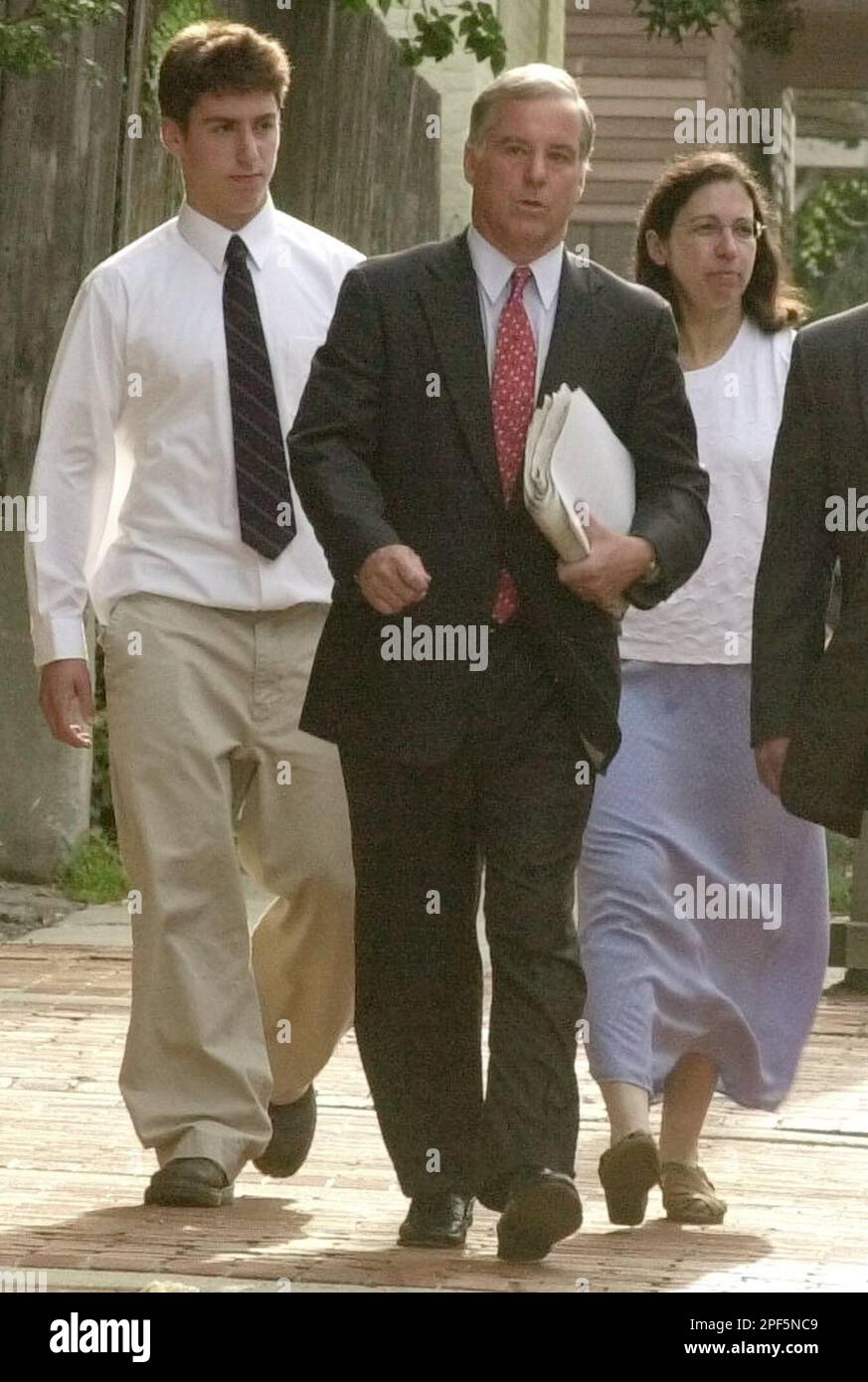 Former Vermont Gov. Howard Dean, center, walks with his son, Paul, left ...