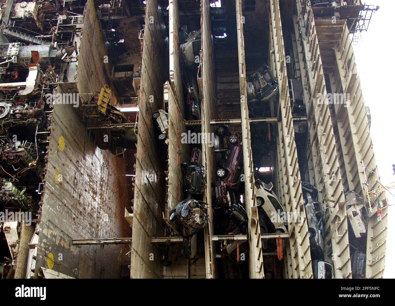 Cars hang in between two car decks of the sunken cargo ship Tricolor as ...