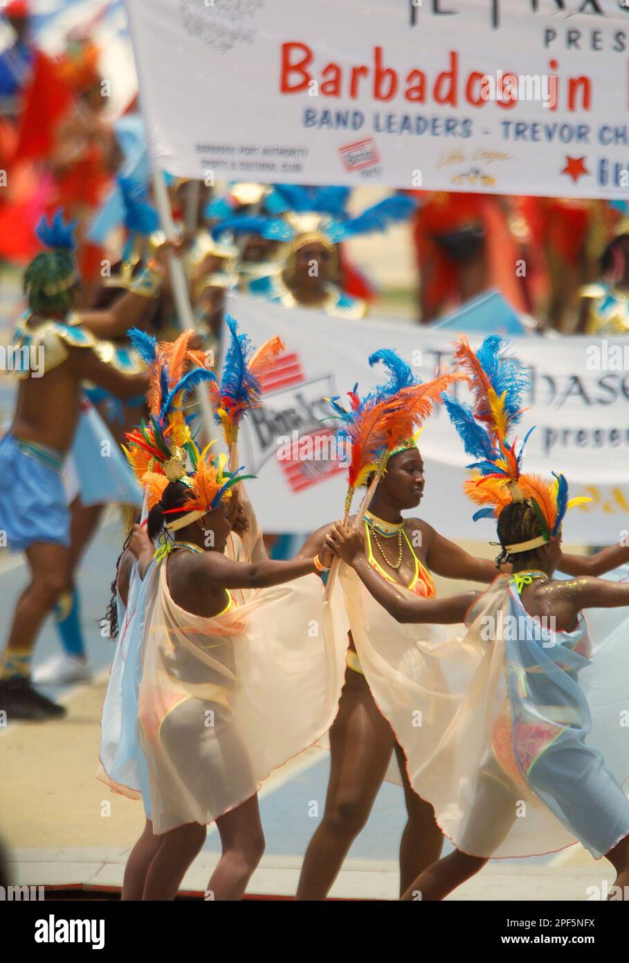 Revelers dance to calypso music in St. Michael parish, Barbados, Monday ...