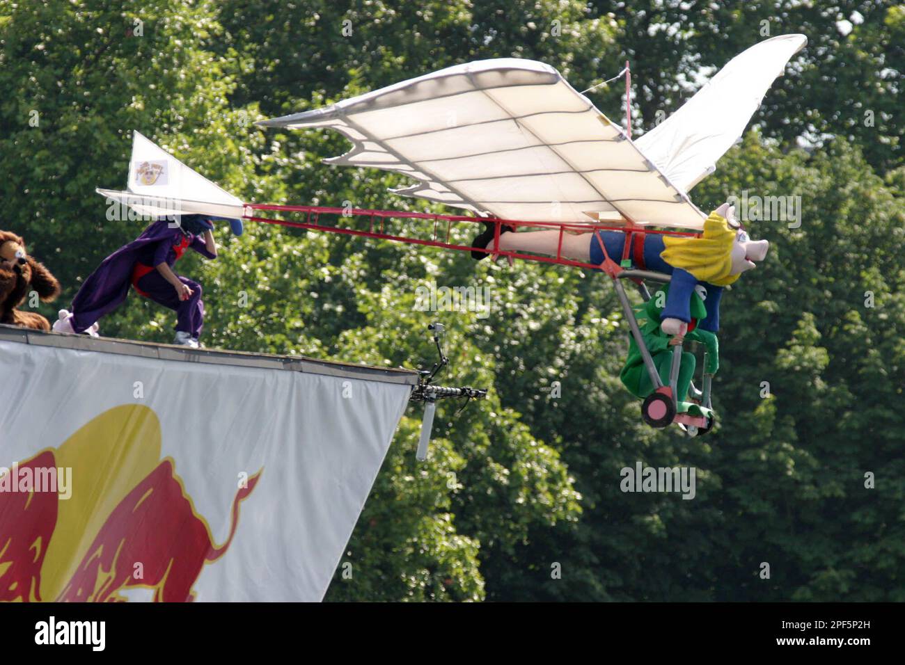 Winner team 'Miss Piggy', flies off a 6m ramp in their man-powered ...