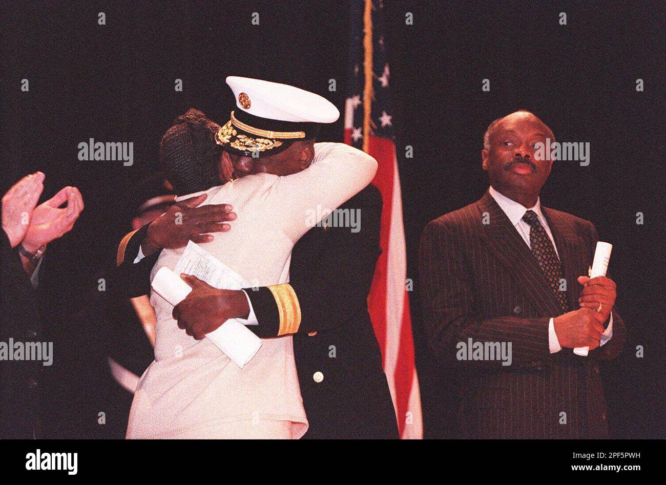 DEMMONS 1/C/16JAN96/CD/LS Bob Demmons gives wife Willie Demmons a hug ...