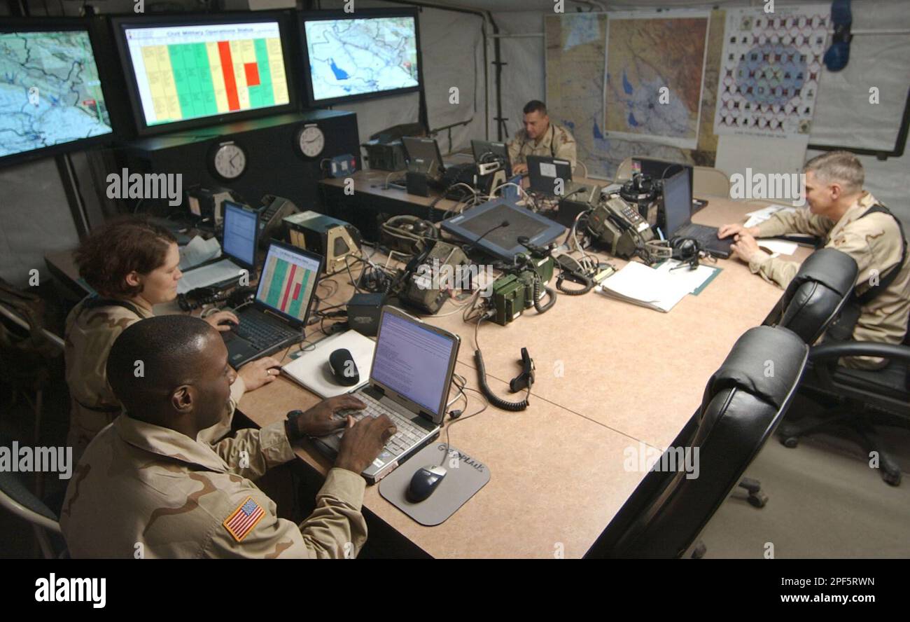 U.S. Army officers work inside the TOC (Tactical Operations Center) of ...