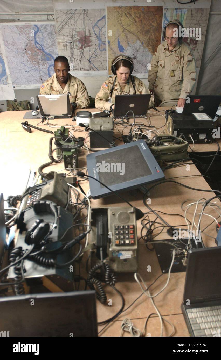 U.S. Army officers work inside the TOC (Tactical Operations Center) of ...