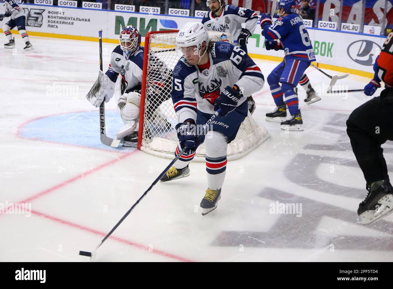Torpedo Hockey Club player, Ivan Kulbakov (No.35), Maxim Fedotov (No.65) seen in action during ...