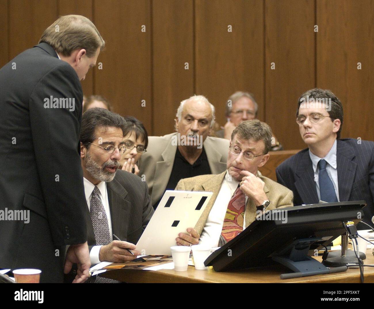 Defense Attorney David Rudolf, second from left, questions a photograph ...