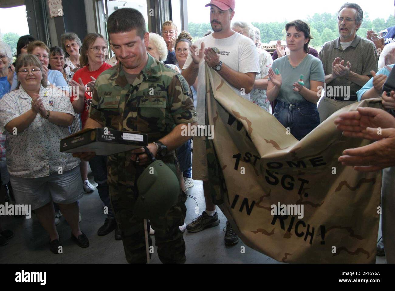 First Sgt. Colin R. Rich of the U.S. Army 82nd Airborne, left center ...