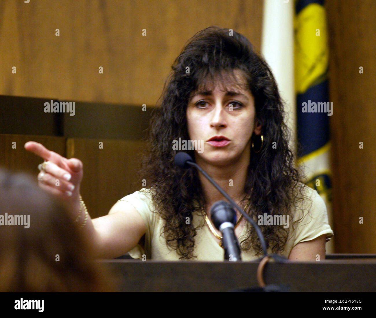 Pamela Berfield, sister of the Sandra Berfield, points to defendent ...