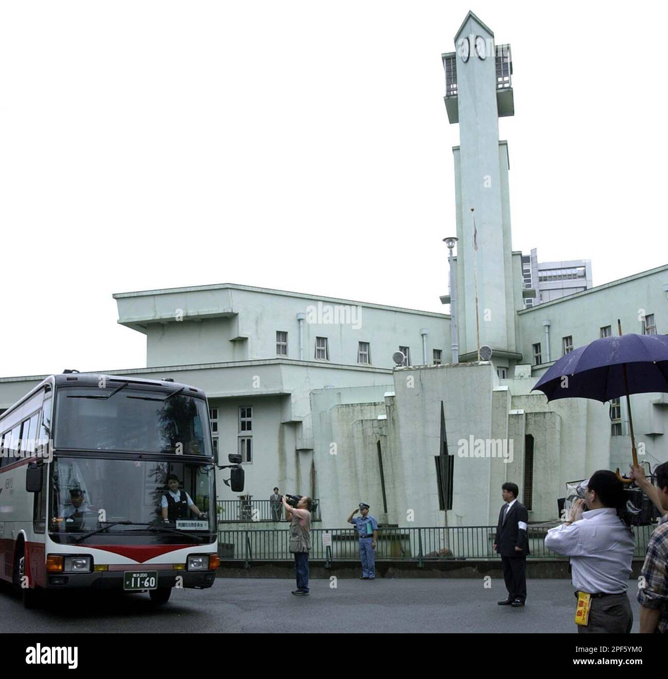 A bus carrying members of the Lower House Justice Committee leaves ...