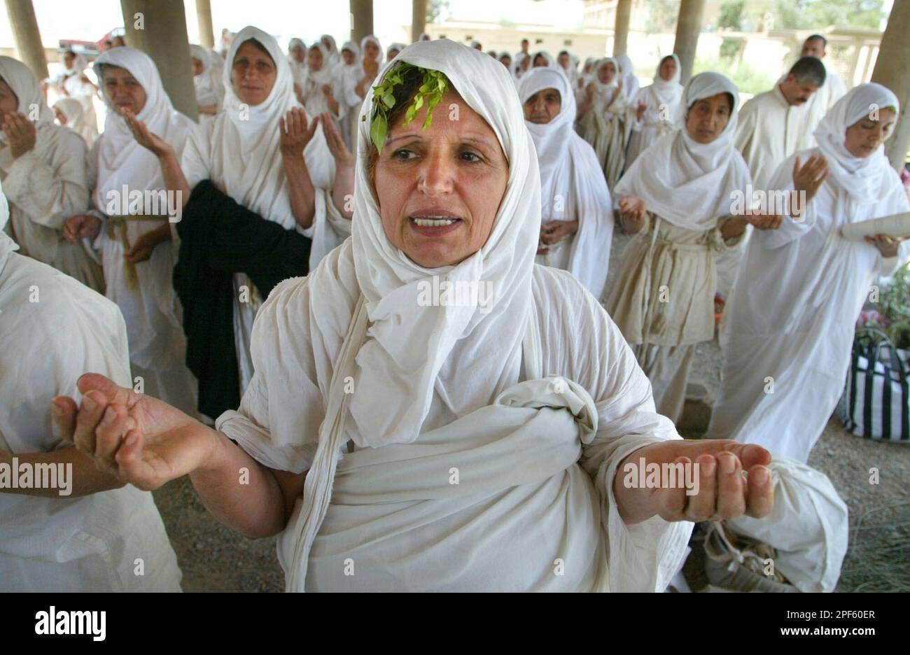 Iraqi Sabaean Mandean women pray together after being baptized in the ...