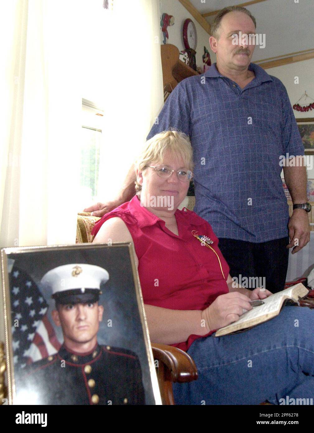 Marine Sgt. David Bell's parents, Ernie and Betsy Bell, pose with their ...