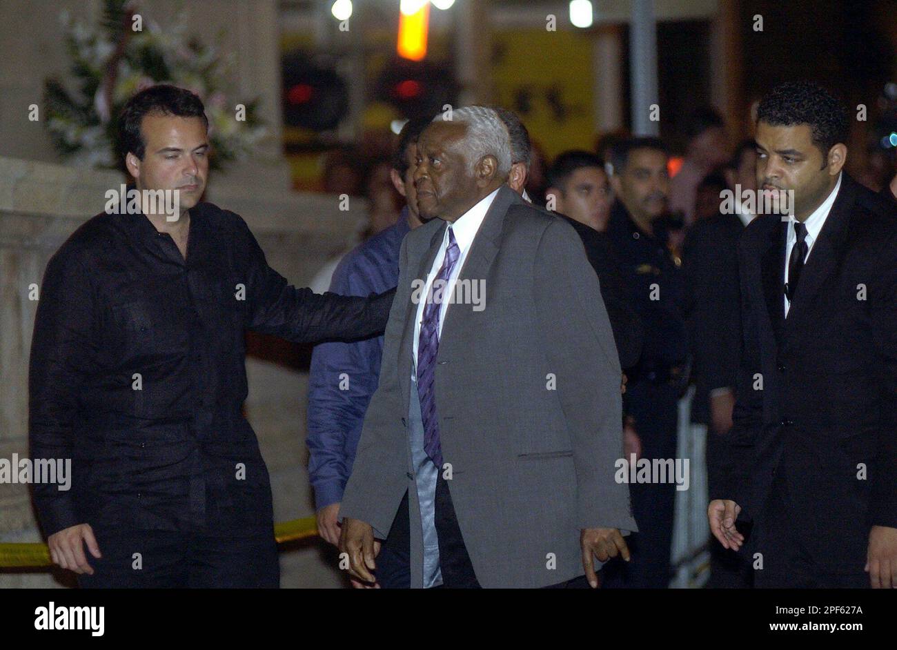 Pedro Knight, center, arrives at the Freedom Tower in Miami, Friday ...