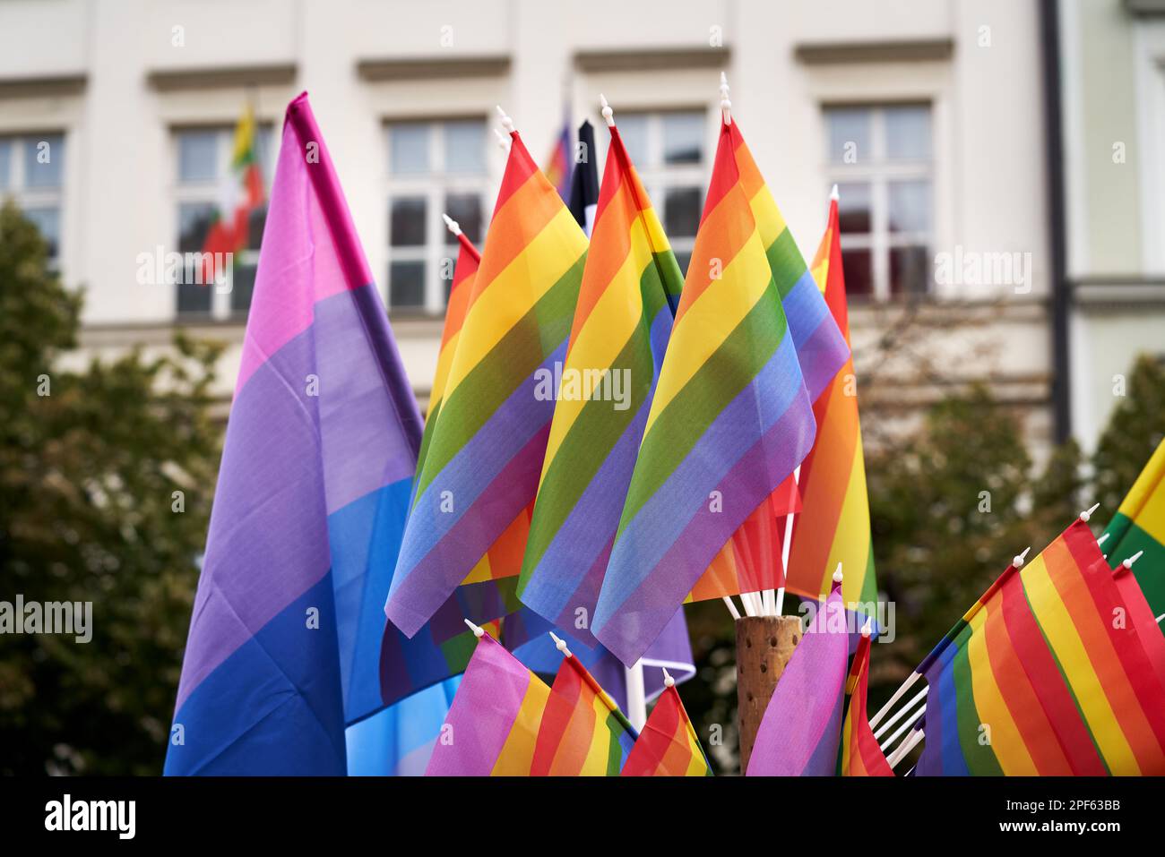 Rainbow flags in the street during gay pride Stock Photo - Alamy