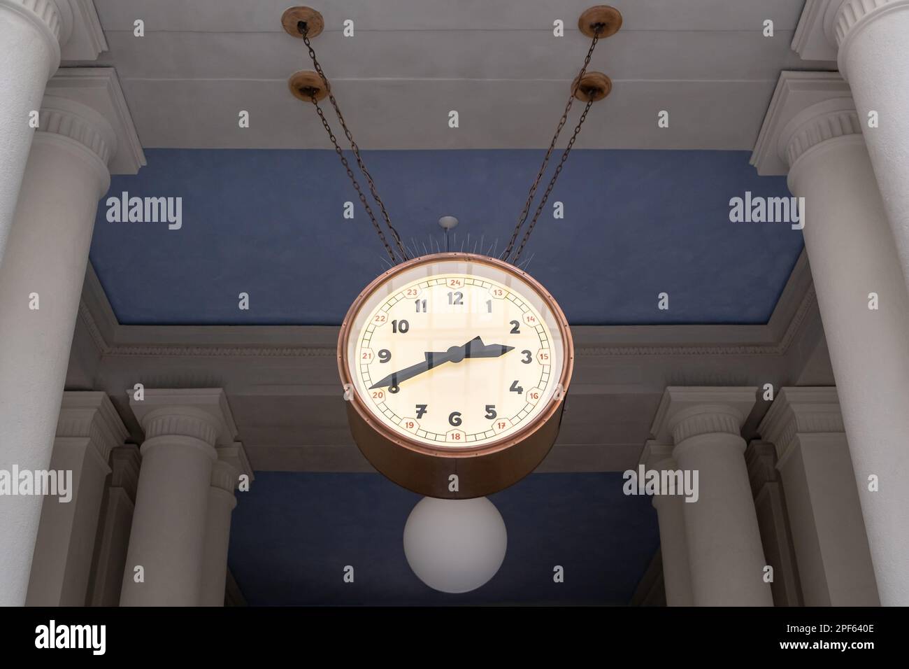 Hanging clock in a At Railroad Station in Prague. Time in Public place ...