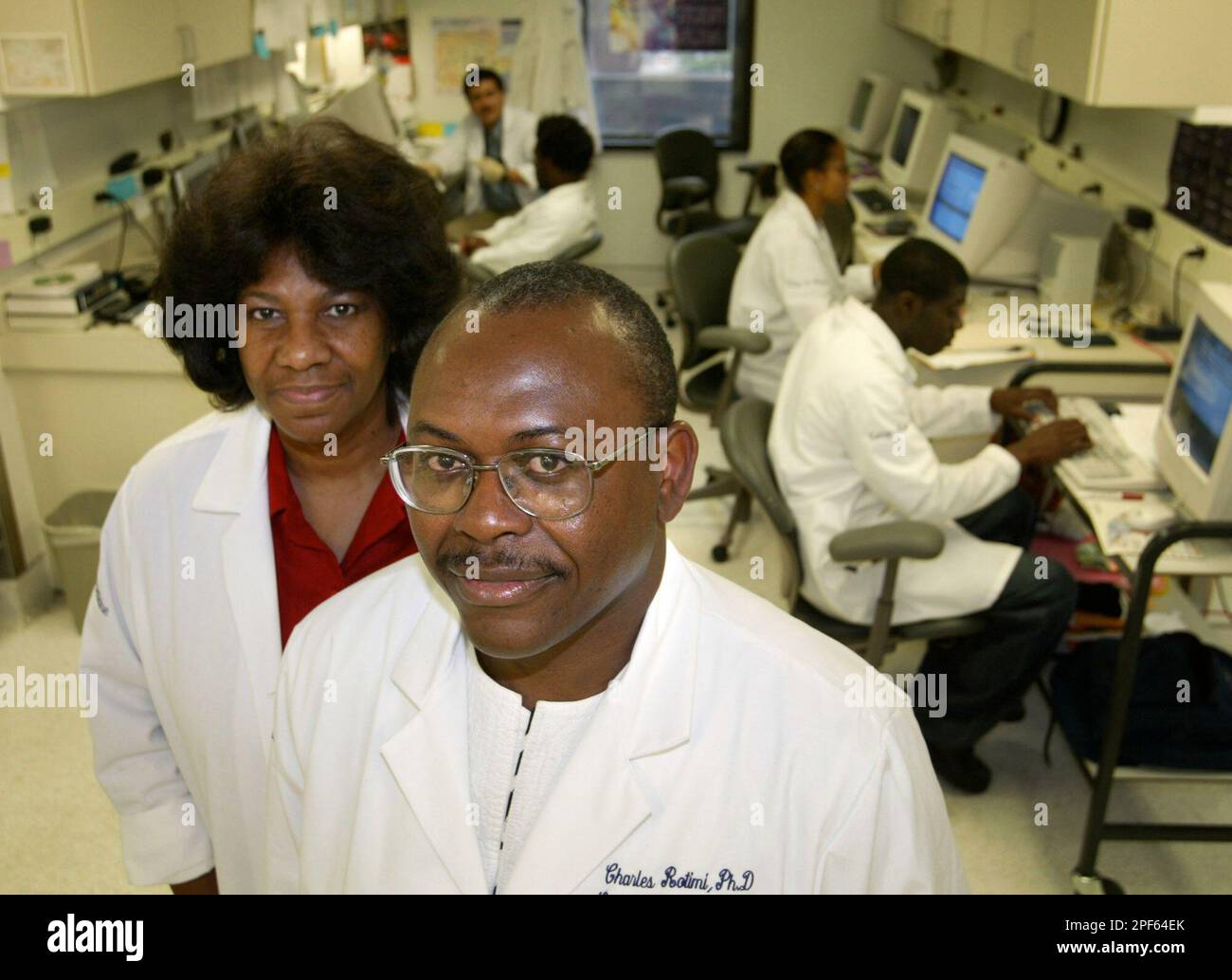 Dr.'s Charles Rotimi, center, and Georgia Dunston, left, both genetic ...