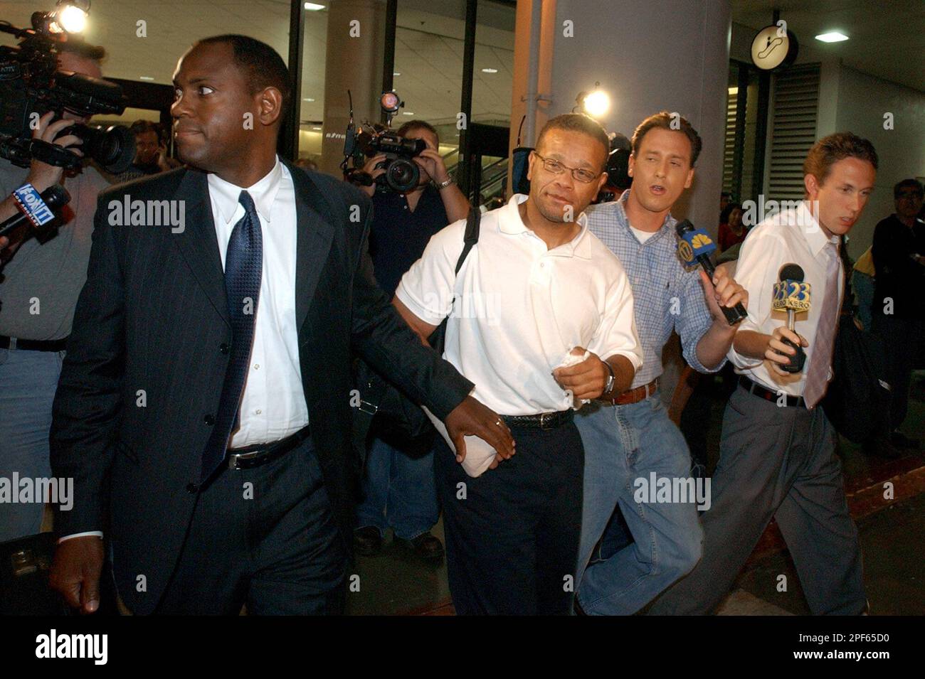Vincent Brothers, second from left, and his attorney, Curtis Floyd ...