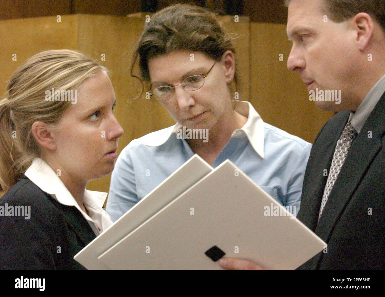 Durham District Attorney Jim Hardin, right, speaks with Caitlin Atwater ...