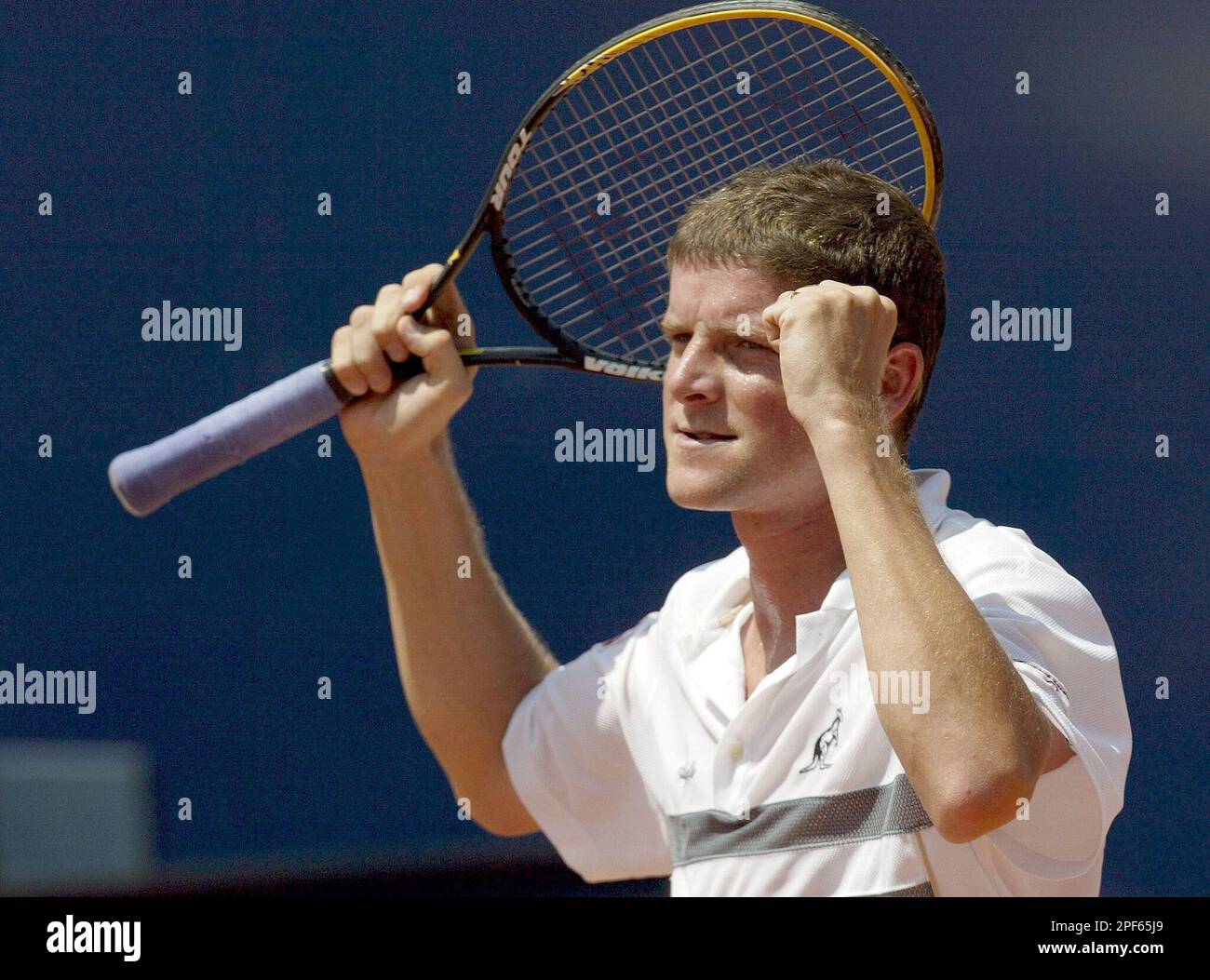 Jiri Novak from the Czech Republic raises his arms after winning his ...
