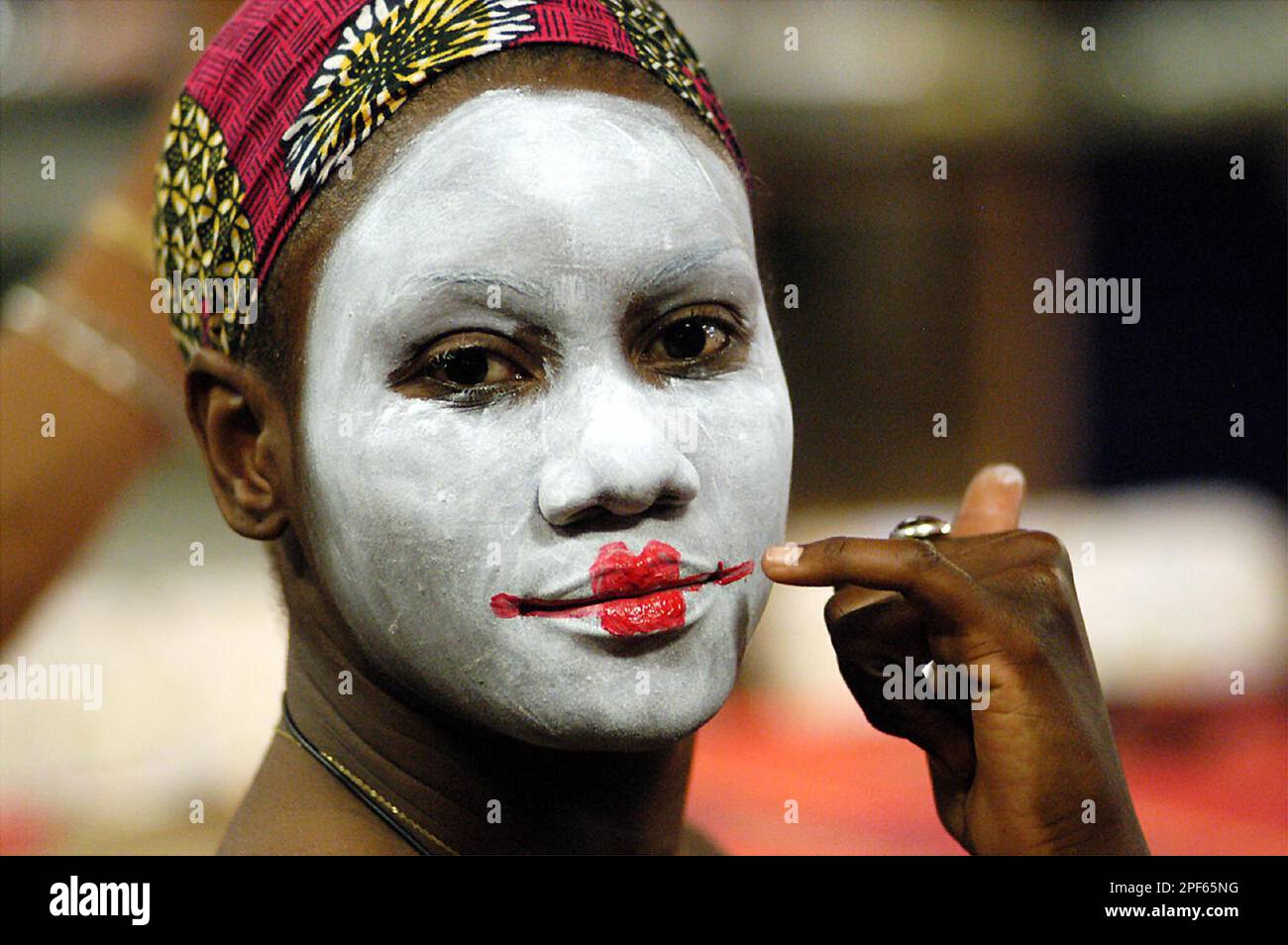 Tapuwa Mhere of Zimbabwe applies make-up as she prepares to play the ...