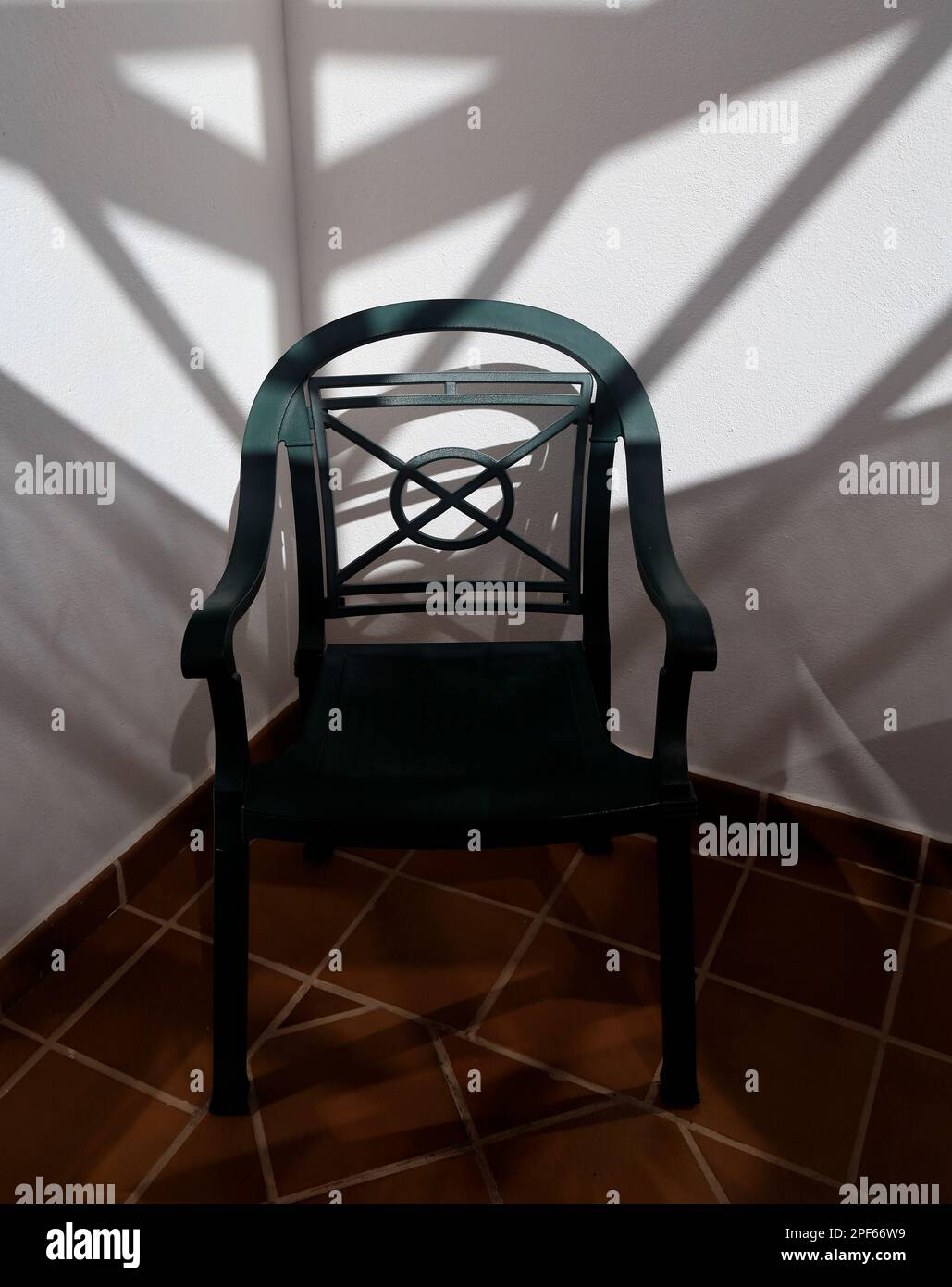 Sunlight through chair against a white wall. Abstract patterns, light ...