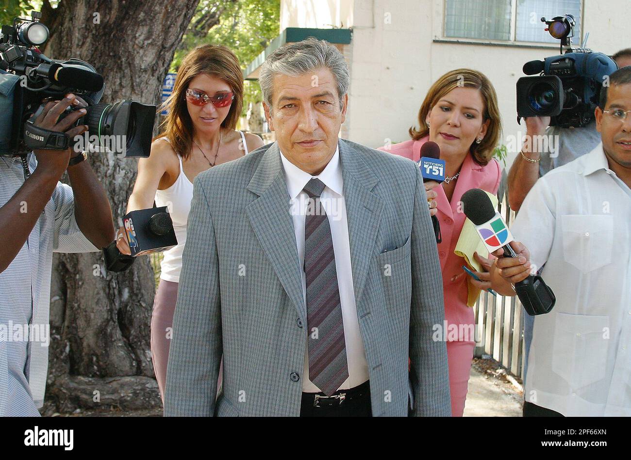 Cubana airlines pilot Jorge Armando Rojas, center, is swarmed by Miami ...