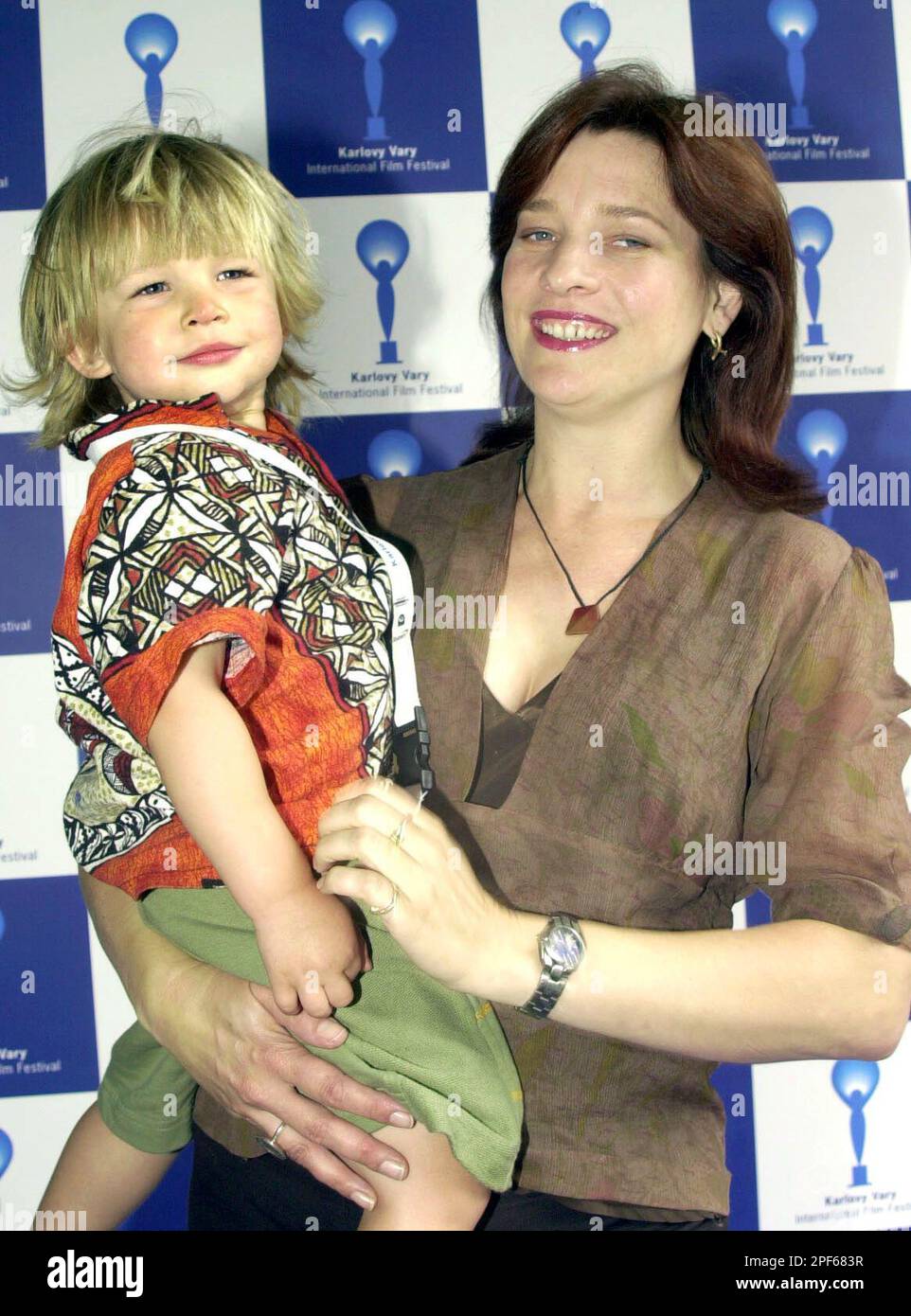 New Zealand's actress Kerry Fox poses for photographers with her son ...