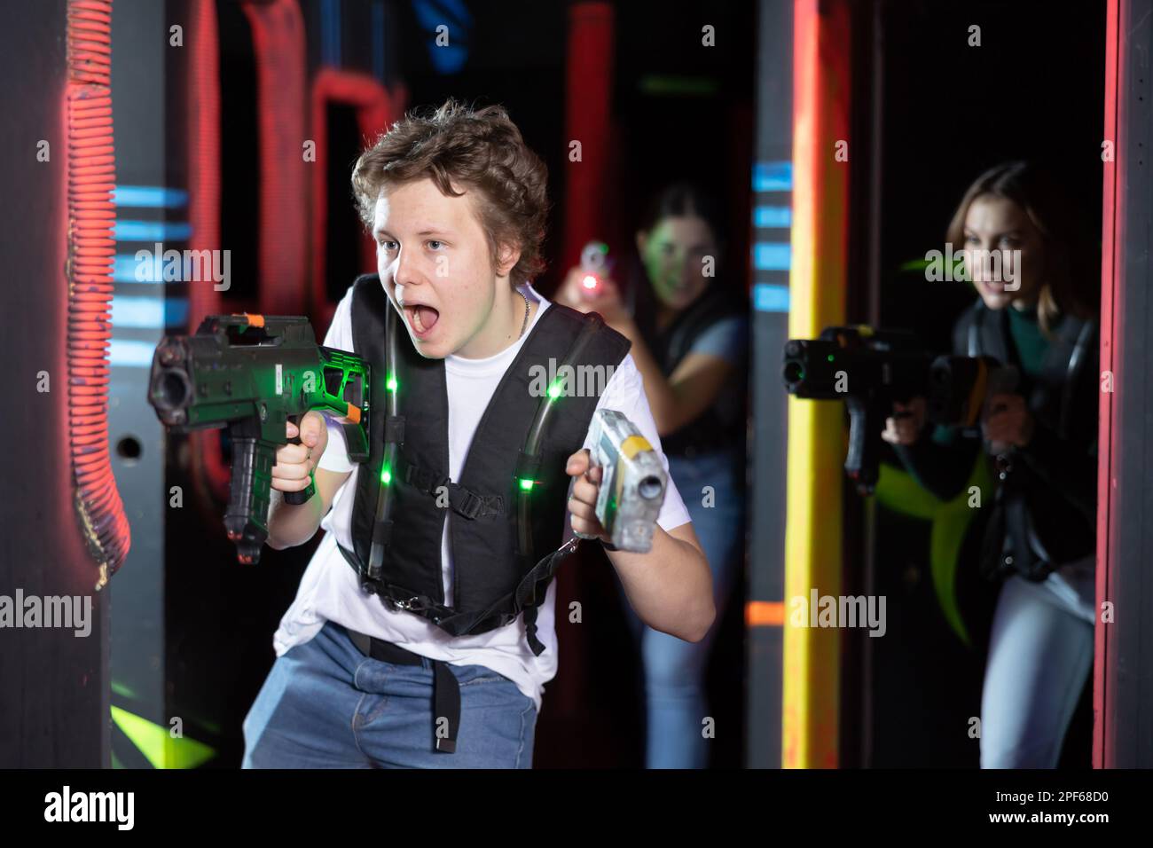 Young guy playing lasertag in arena Stock Photo - Alamy