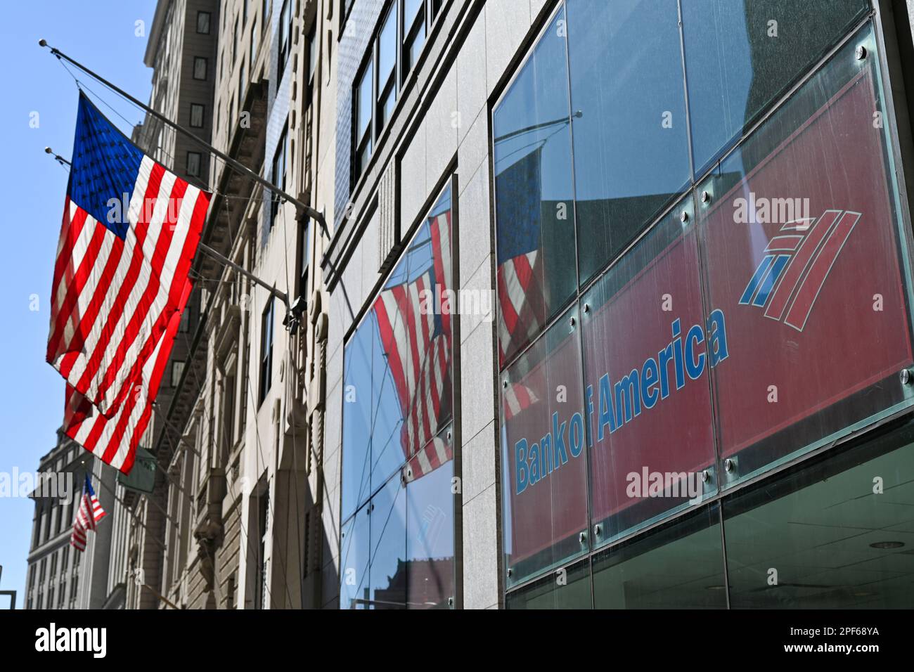 American flags hang outside a Bank of America Corp. bank branch along ...