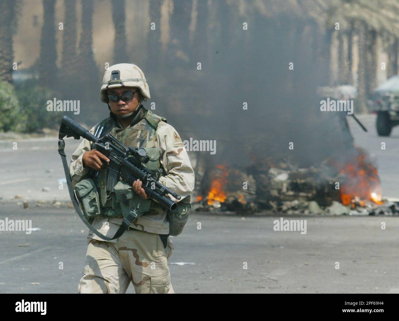 A US soldier secures the scene of an RPG (Rocket Propelled Grenade ...