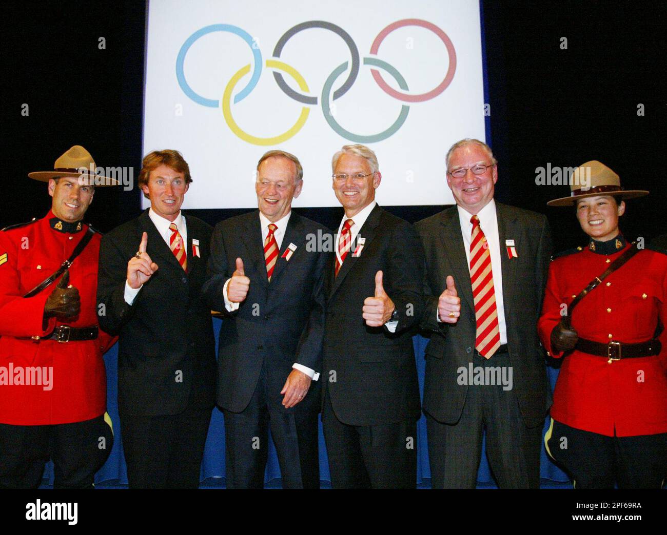 From left: RCMP Cpl. Ed Gariepy, Wayne Gretzky, Canadian Prime Minister ...
