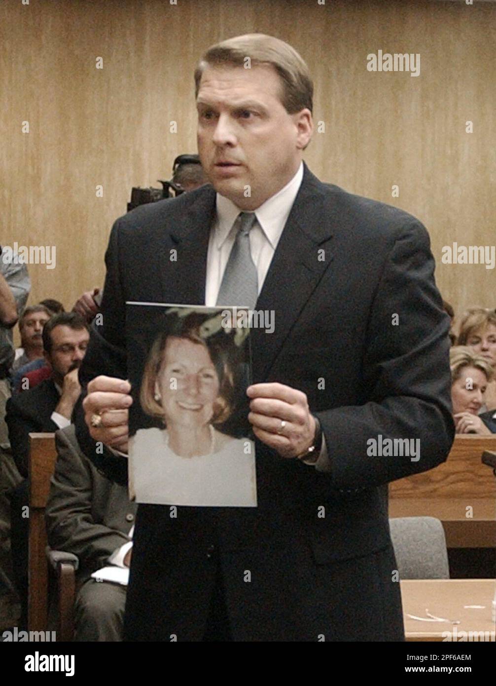 Durham, N.C., District Attorney Jim Hardin holds a photo of murder ...