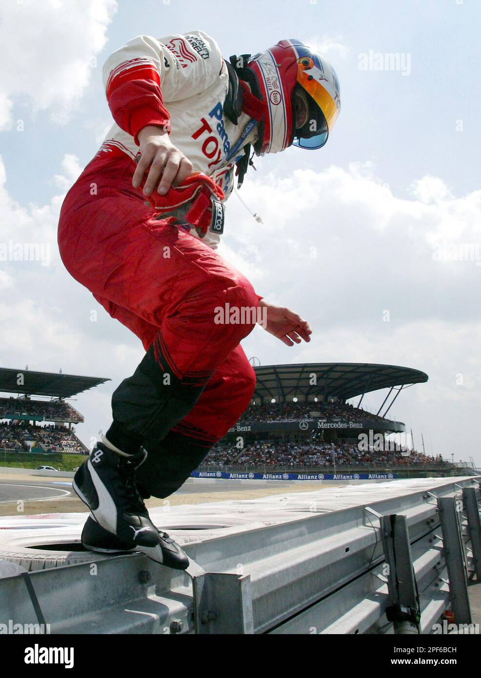 French Formula One driver Olivier Panis of team Toyota jumps over a ...