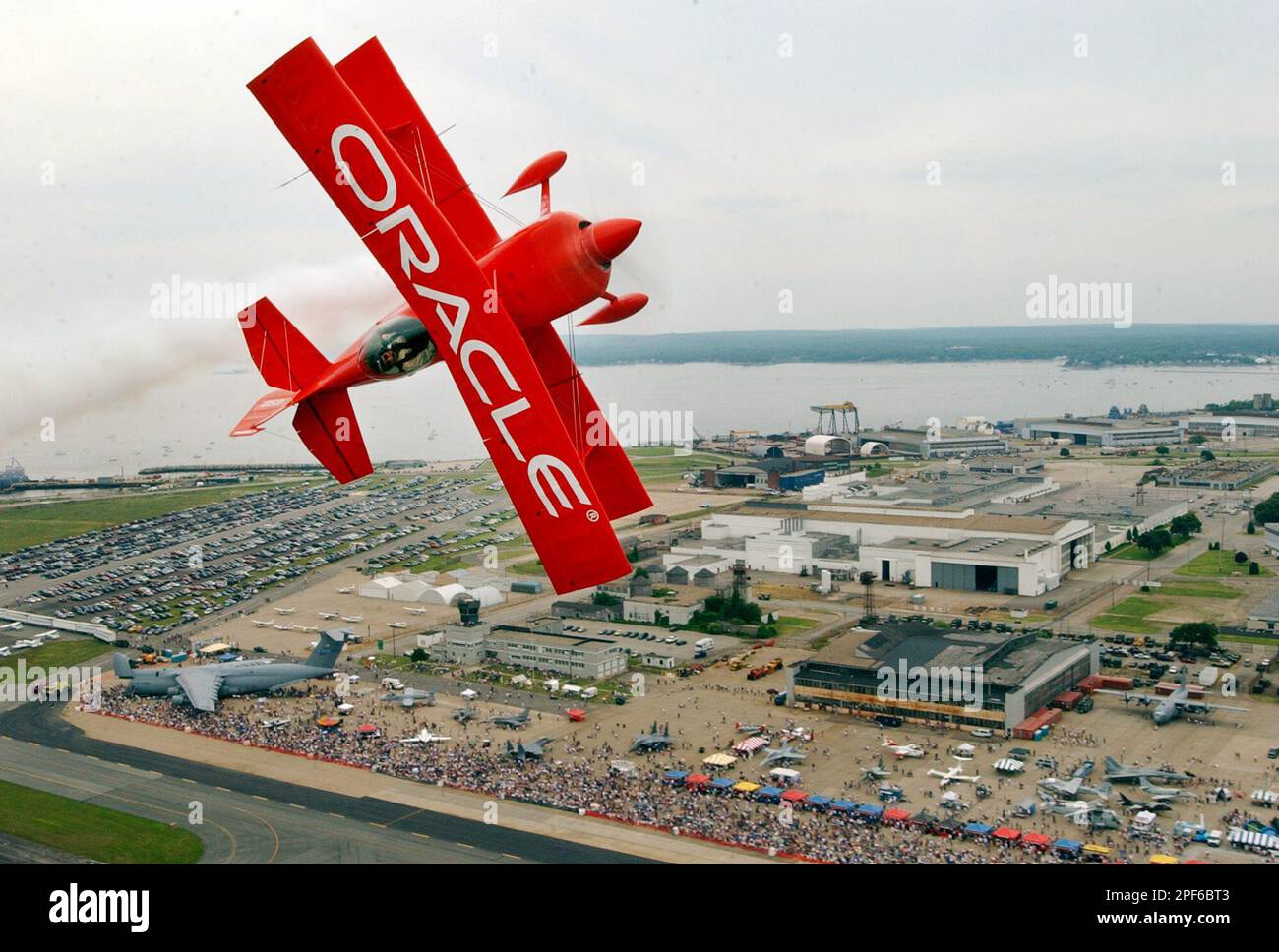 Sean D. Tucker performs a rolling maneuver in his Oracle Challenger ...