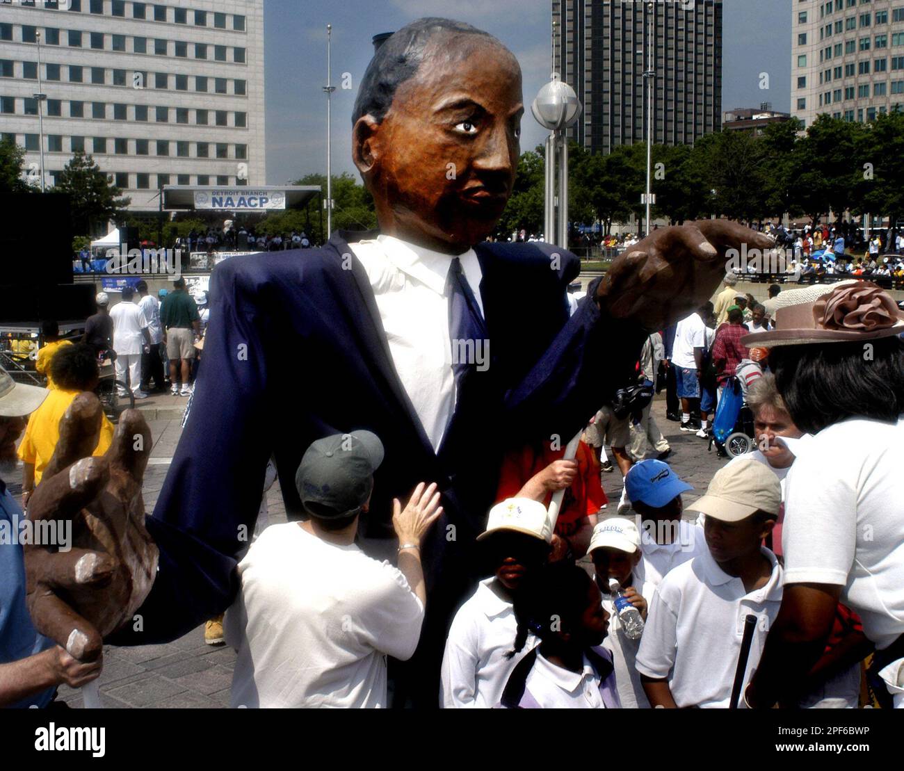Participants pose for pictures with a puppet of Dr. Martin Luther King ...