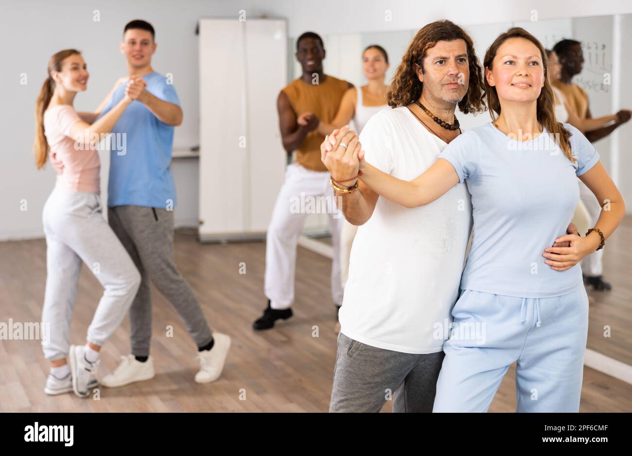 People dancing together slow ballroom dances in pairs in choreography ...