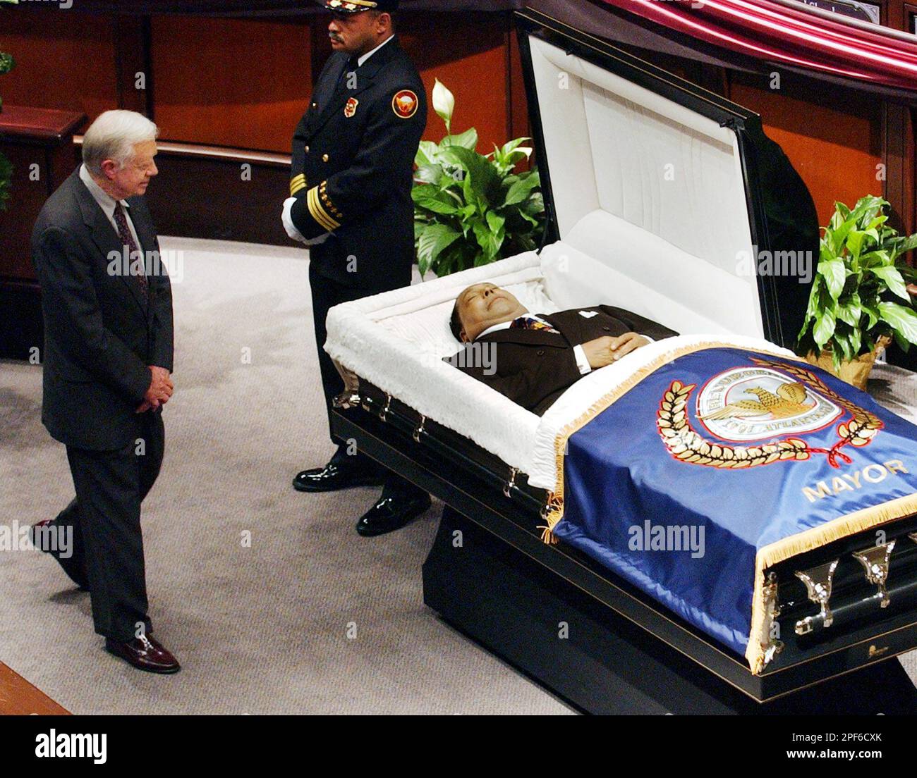 Former President Jimmy Carter approaches the body of former Atlanta ...