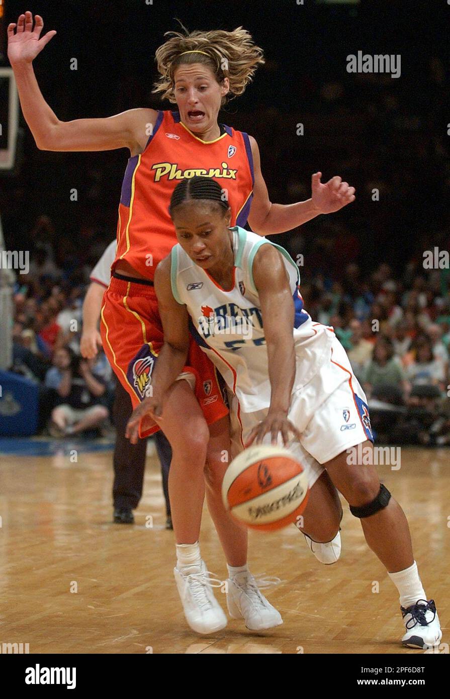 New York Liberty's Vickie Johnson drives around Phoenix Mercury's Anna ...