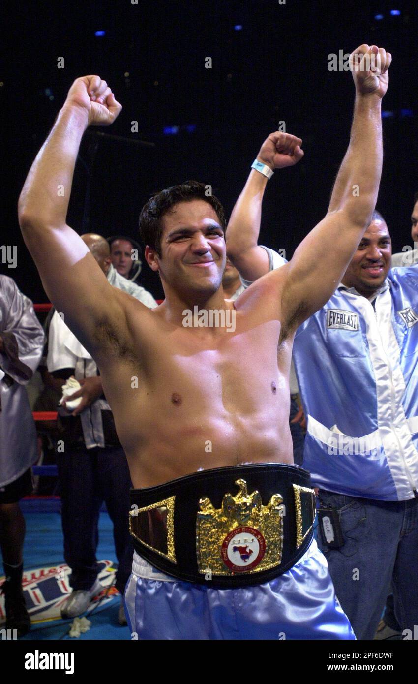 Joe Mesi celebrates his first round knock-out of Robert Davis in their ...