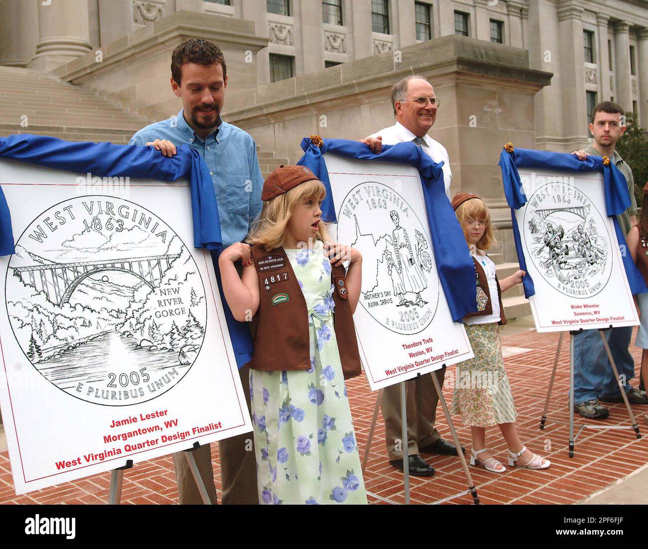 Jamie Lester of Morgantown, left, Theodore Trefz of Weston, center, and ...