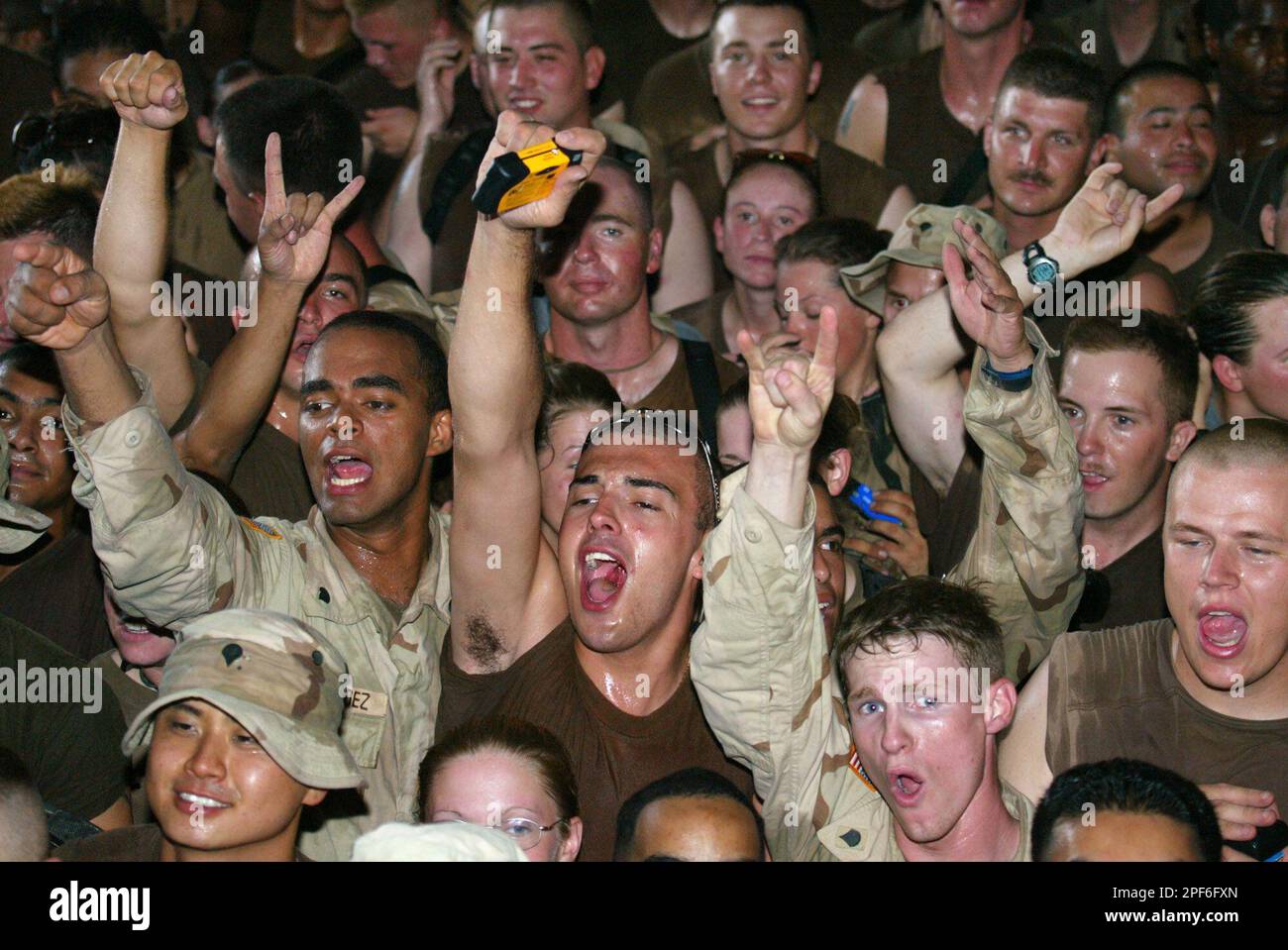 U.S. soldiers cheer during a performance of U.S. singer Kid Rock at a ...