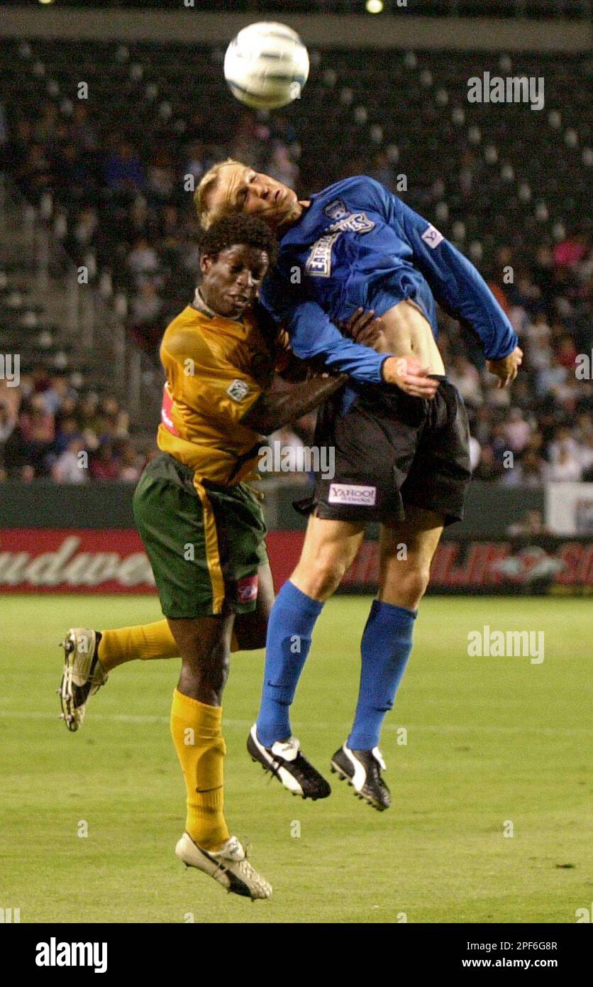 San Jose Earthquakes' Chris Roner, right, heads the ball away from Los ...