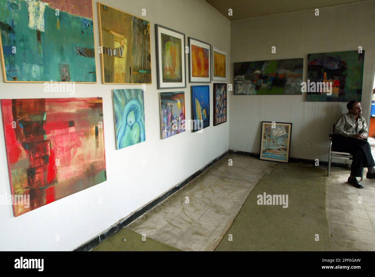 Works of a group of Iraqi artists are displayed in an exhibition at the ...