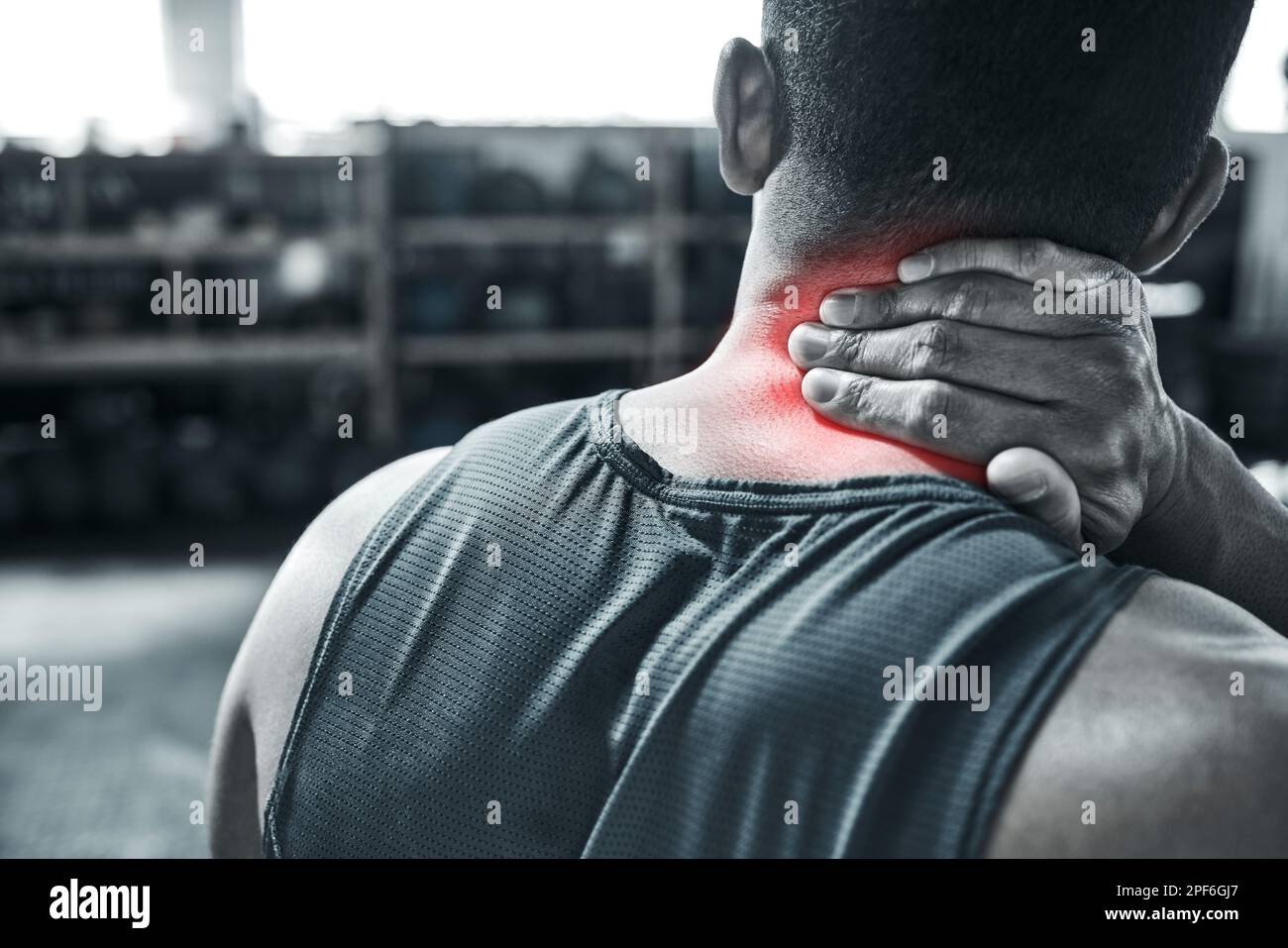 Neck pain can stop any bodybuilder. Back of an athlete with neck pain ...