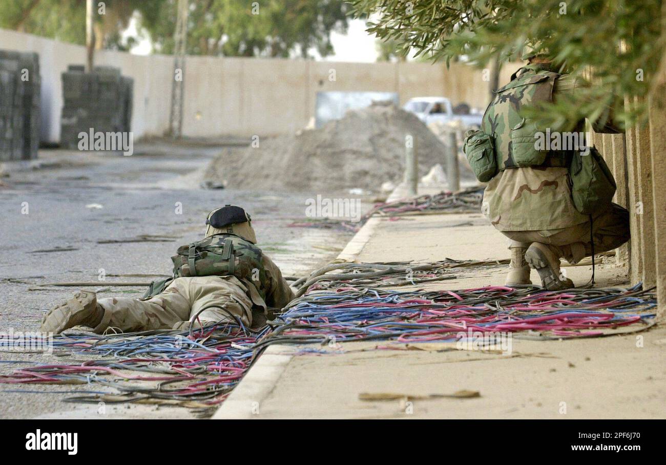 Soldiers from the U.S. Army 3rd Armored Cavalry Regiment take cover ...