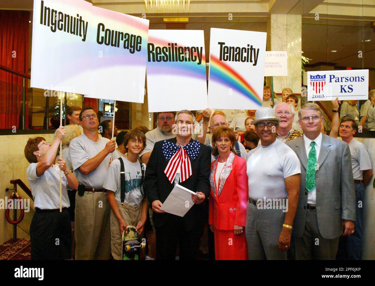 Mayor Tom Shaw, center, poses with residents of Parsons, Kan., after ...