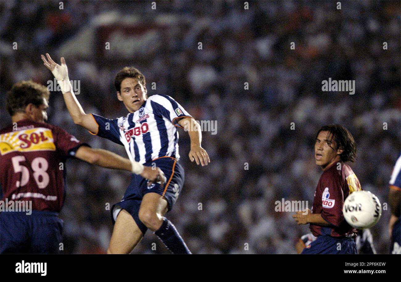 Monterrey's soccer player Guillermo Franco, center, heads the ball as ...