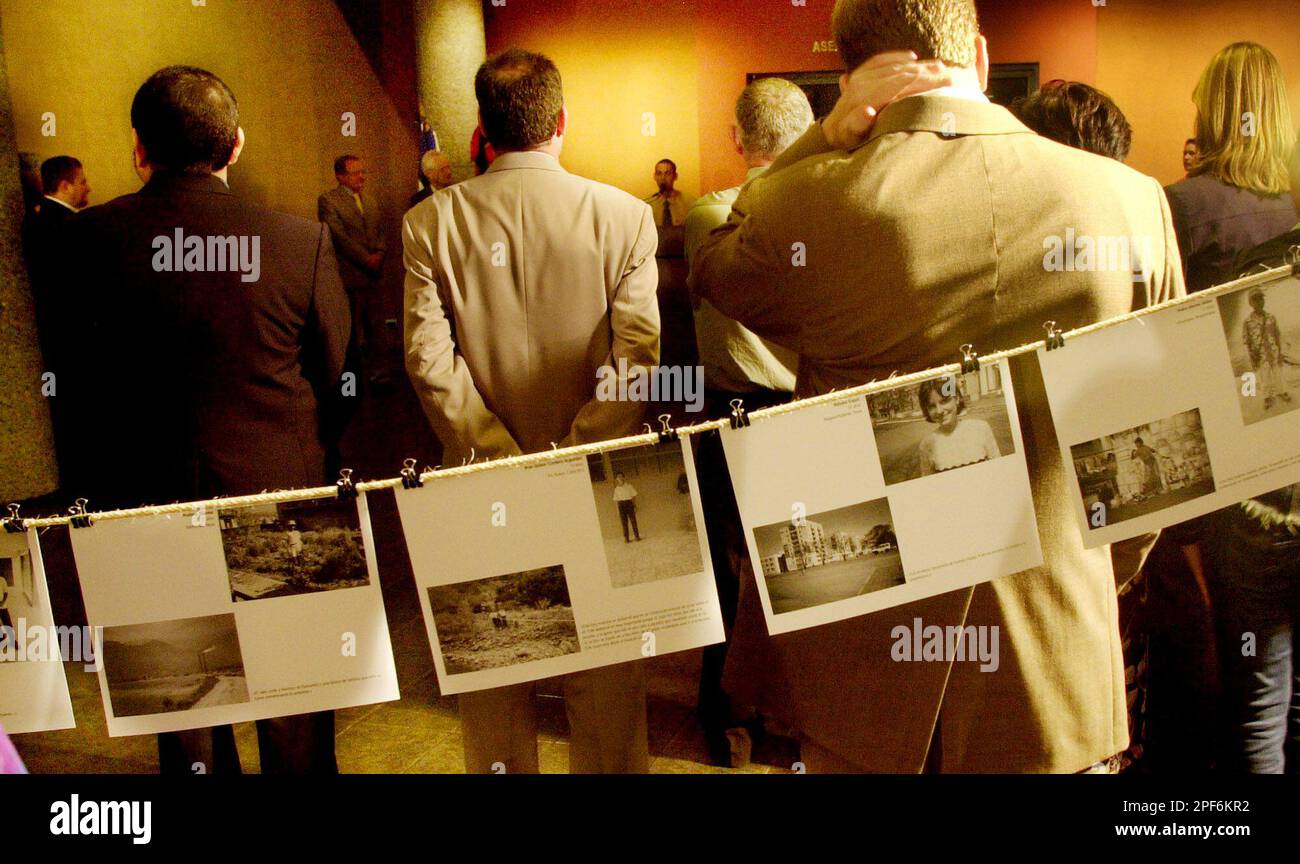 Invited guests attending the "Imagine" exibition listen during the ...