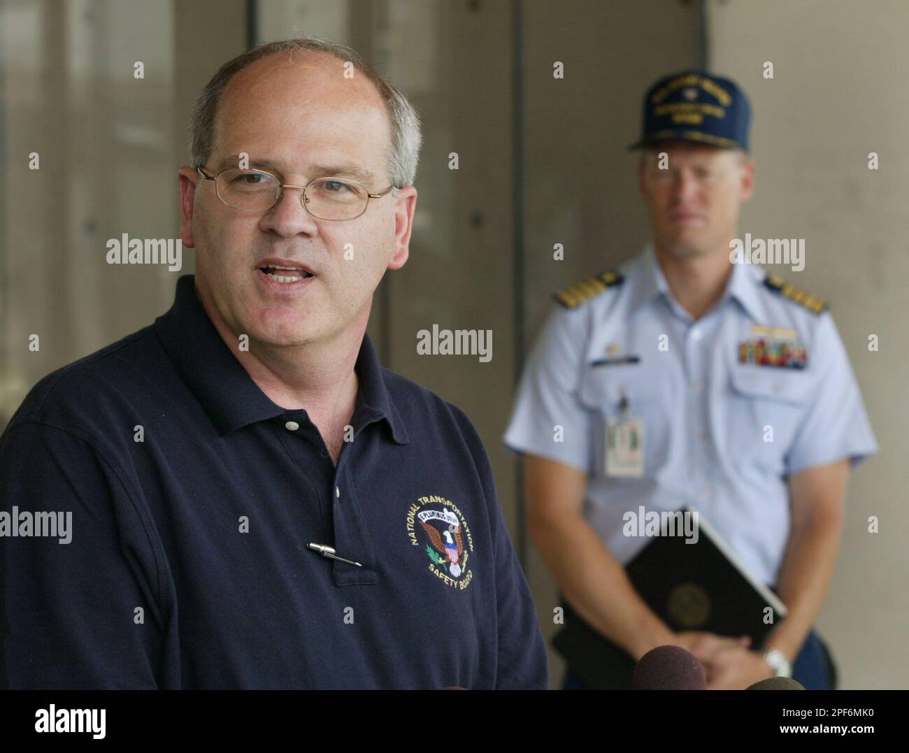 National Transportation Safety Board Capt. Robert Ford, left, faces ...