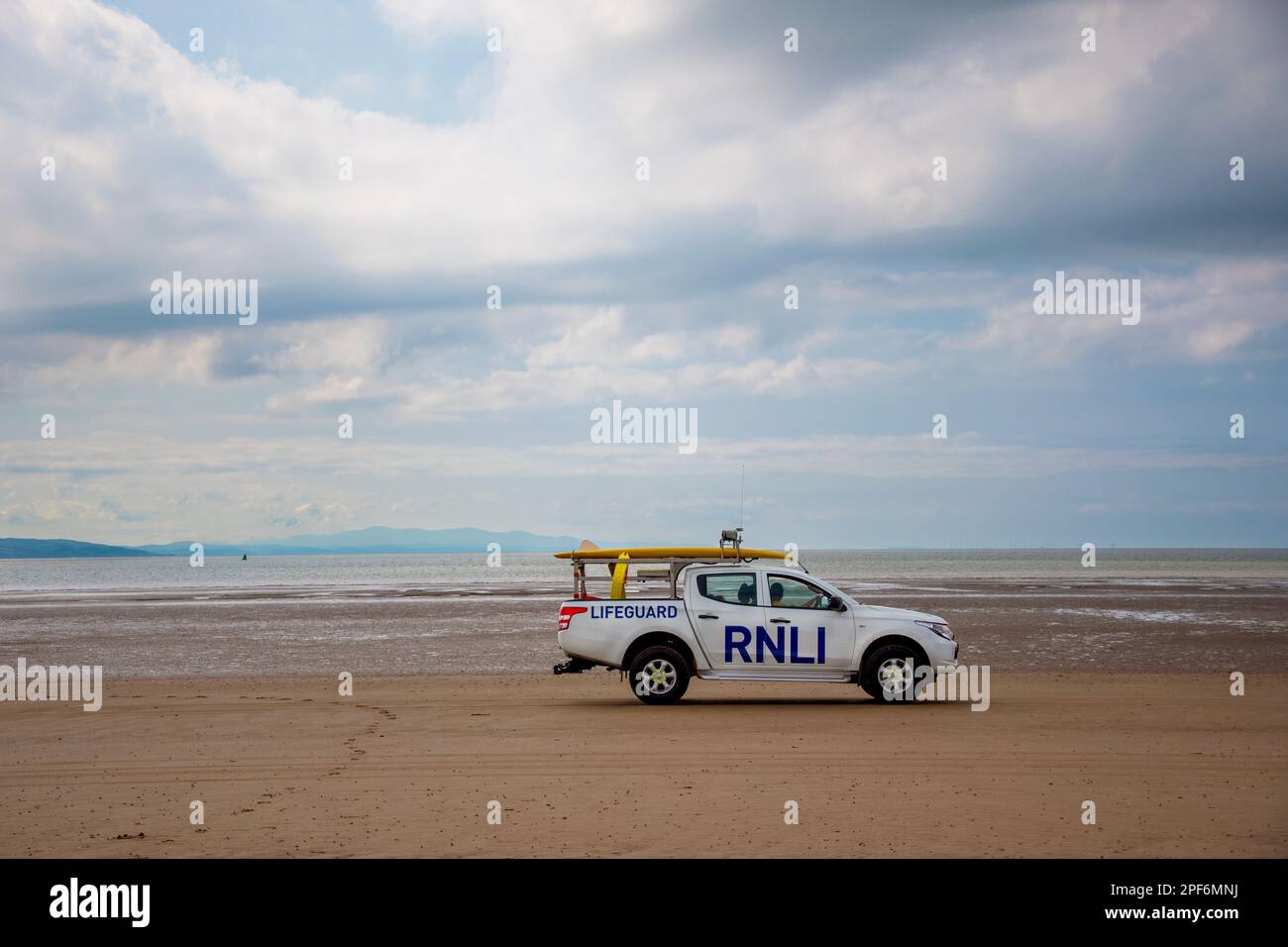 RNLI Lifeguard Mitsubishi 4x4 pick up truck on Crosby Beach, Merseyside ...